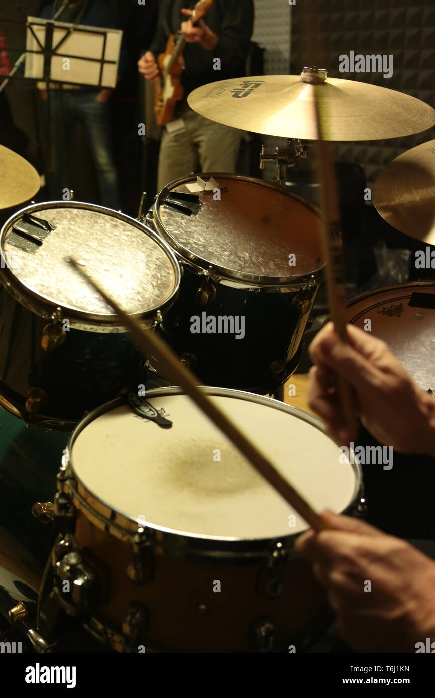 Drummer playing drums. close up. Low Key Stock Photo - Alamy
