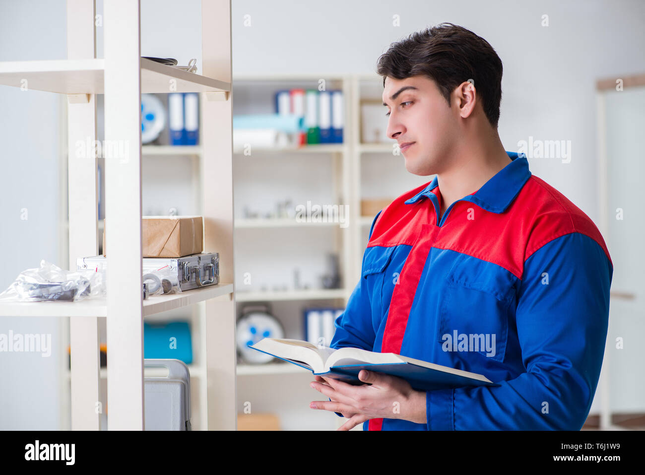 Man working in the postal warehouse Stock Photo - Alamy