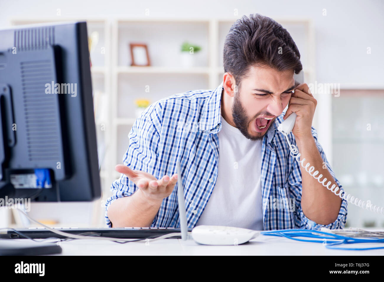 Frustrated young man due to weak internet reception Stock Photo - Alamy