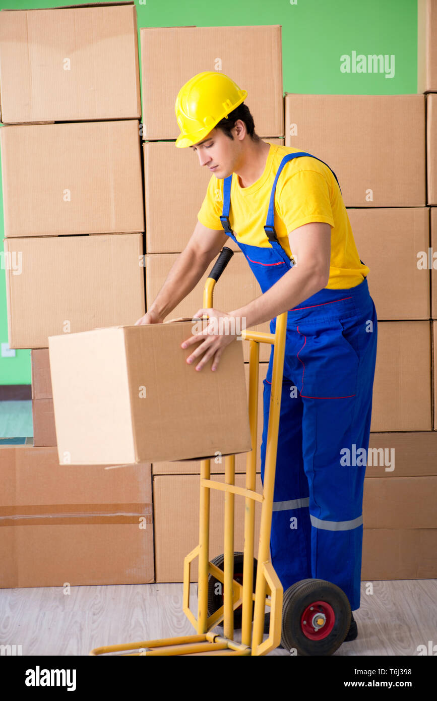 Man contractor working with boxes delivery Stock Photo - Alamy