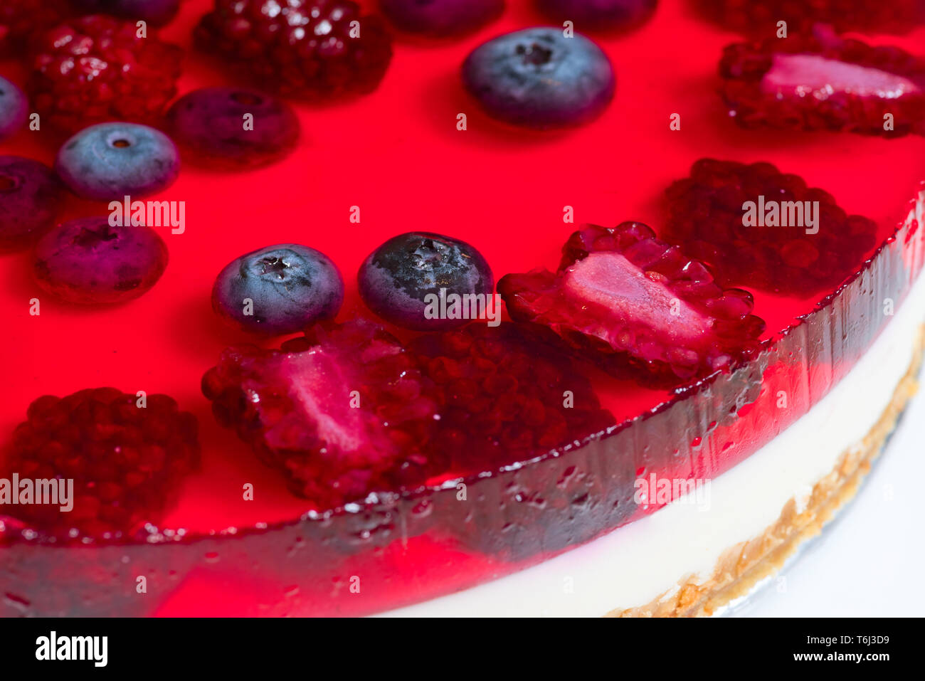 Red cheesecake with wild berries Stock Photo - Alamy