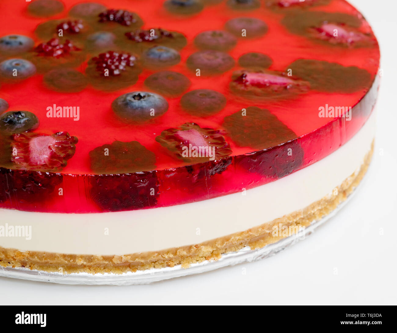 Red cheesecake with wild berries Stock Photo - Alamy