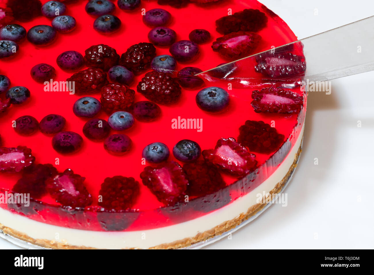 Red cheesecake with wild berries Stock Photo - Alamy