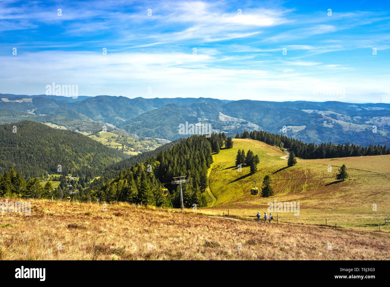 cable lift and hikers on the mountain slope of the Belchen, panorama ...