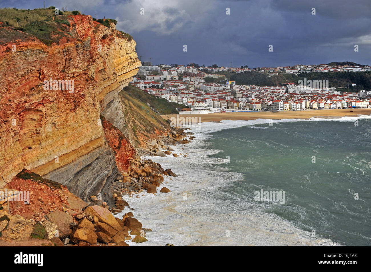 Panorama of Nazare town with dramatic sky on stormy day, Portugal Stock ...