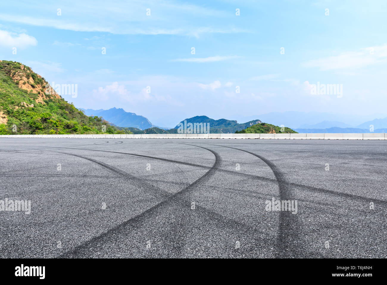 Empty asphalt race track and beautiful natural landscape Stock Photo ...