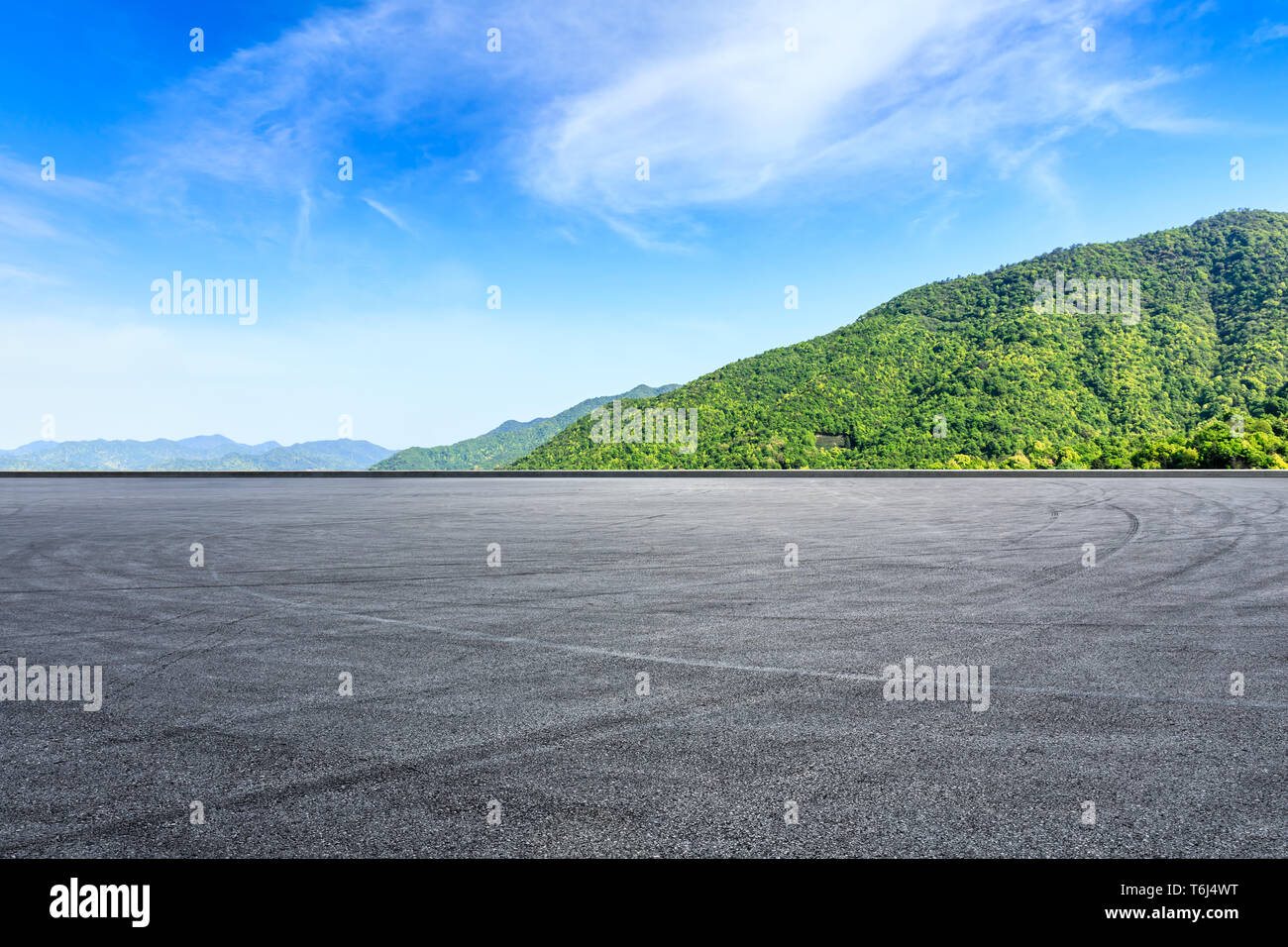 Empty asphalt race track and beautiful natural landscape Stock Photo ...