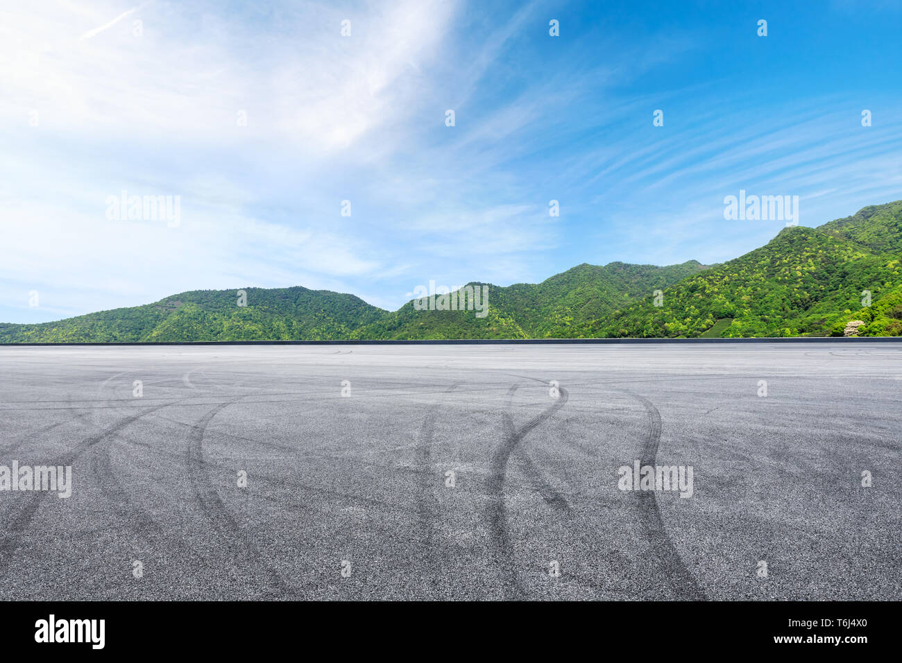 Empty asphalt race track and beautiful natural landscape Stock Photo ...