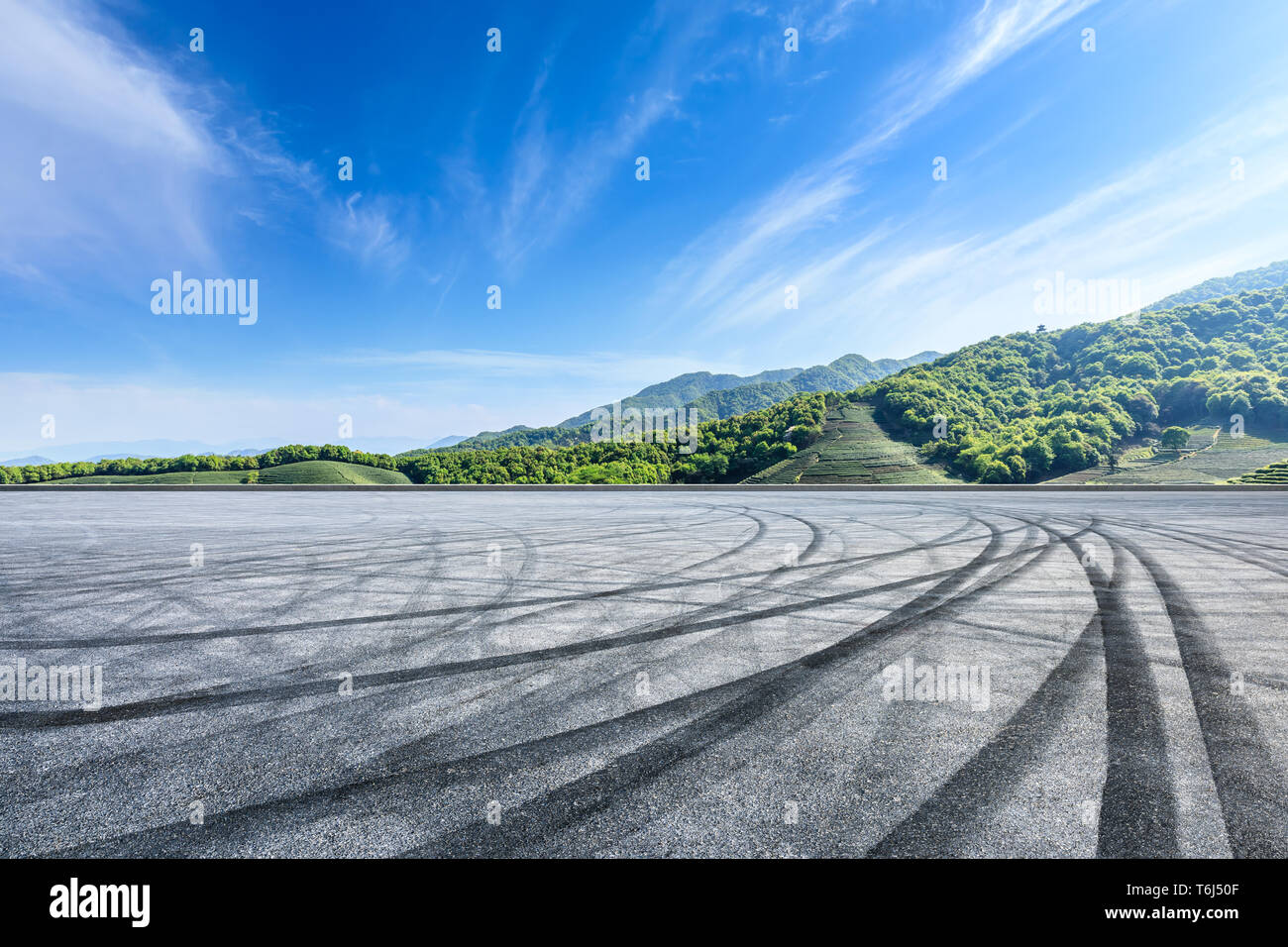 Empty asphalt race track and beautiful natural landscape Stock Photo ...