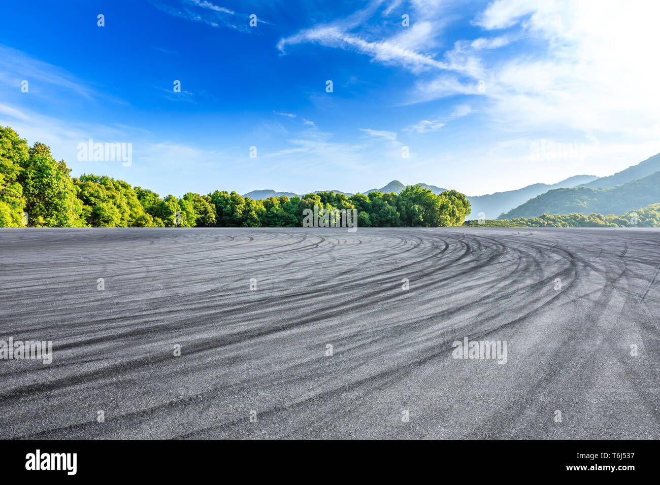 Empty asphalt race track and beautiful natural landscape Stock Photo ...