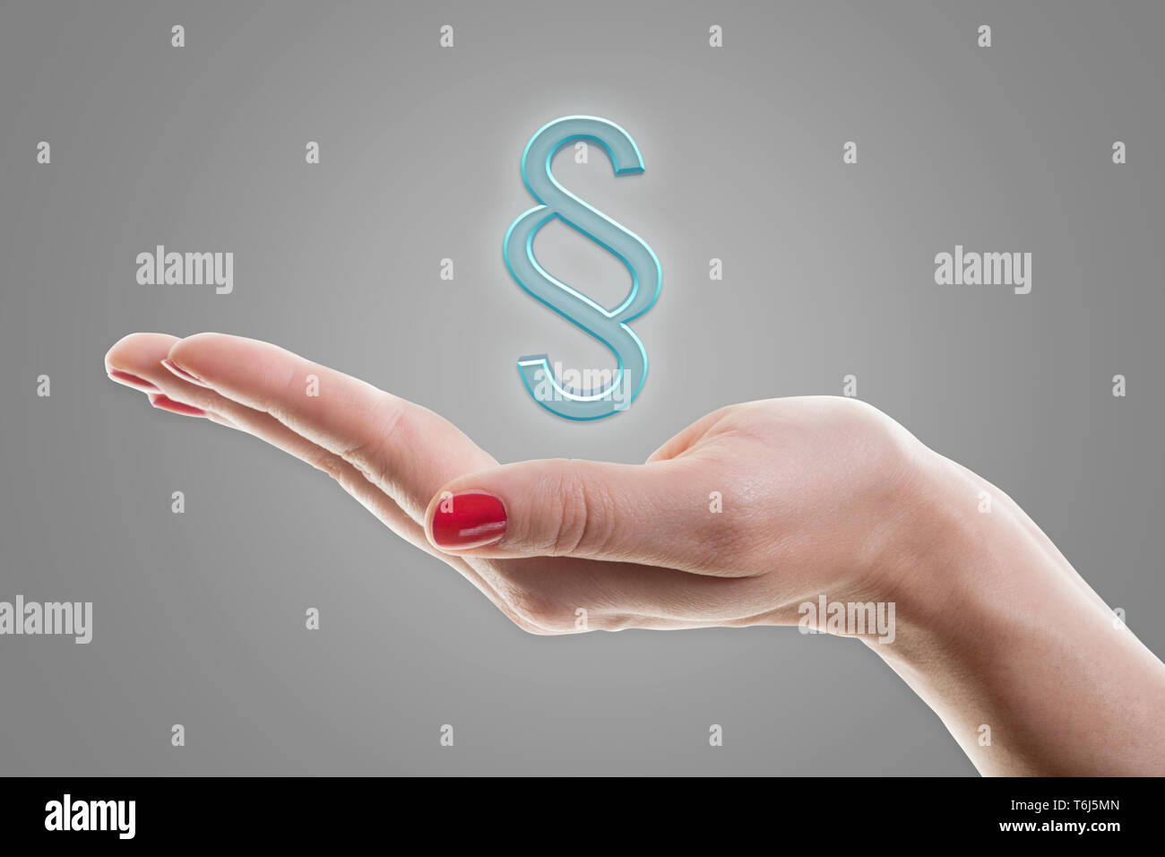 Female hand holding 3d paragraph symbol. Concept for justice Stock ...