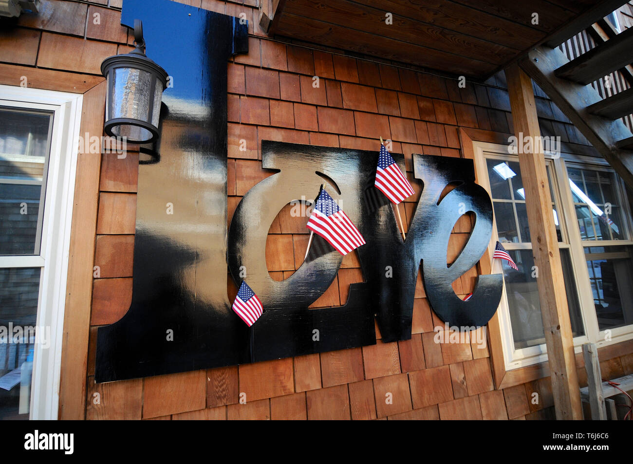 View of a Love inscription decorated with small american flags on a ...