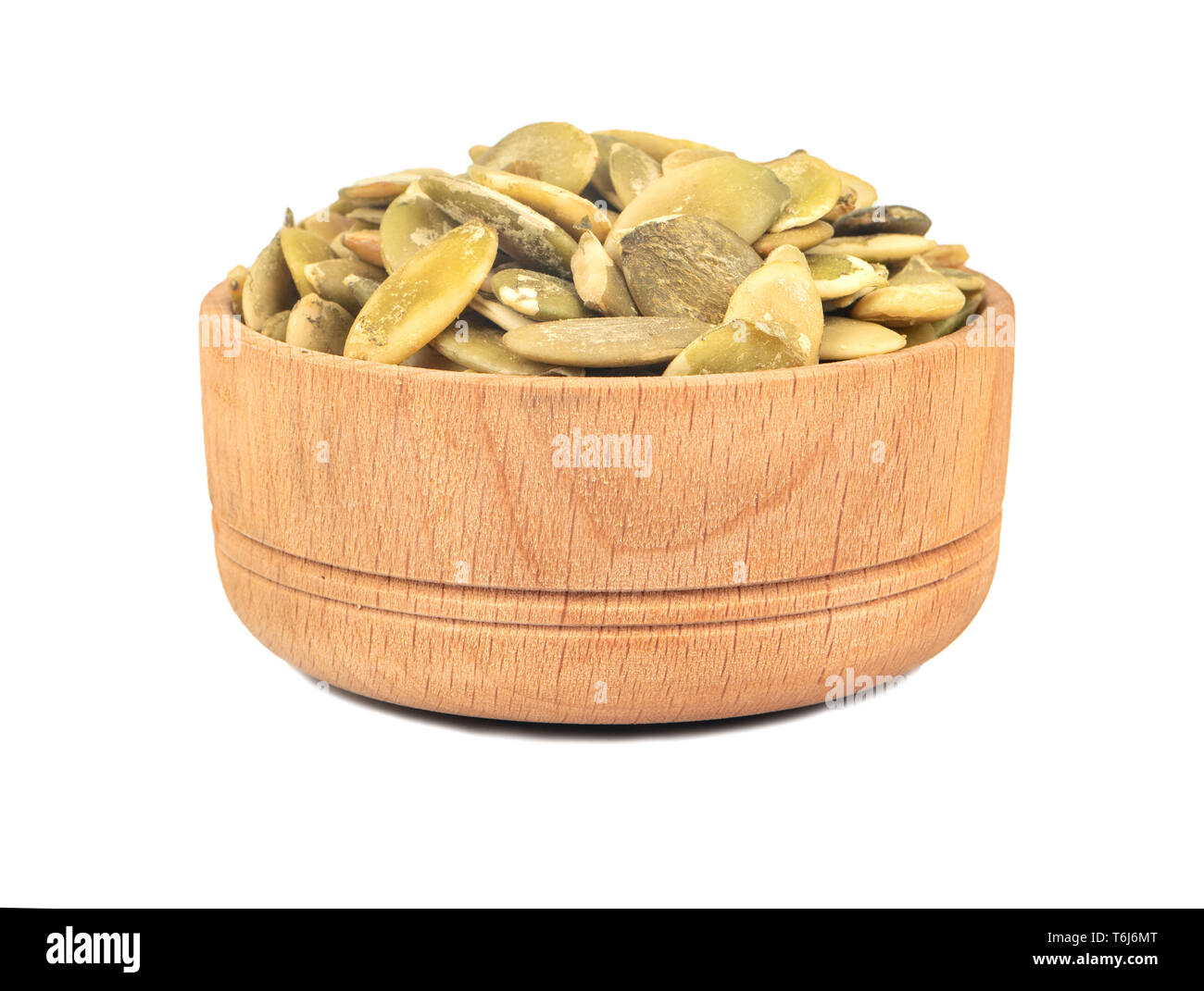Pumpkin seed kernels in bowl on white background Stock Photo - Alamy