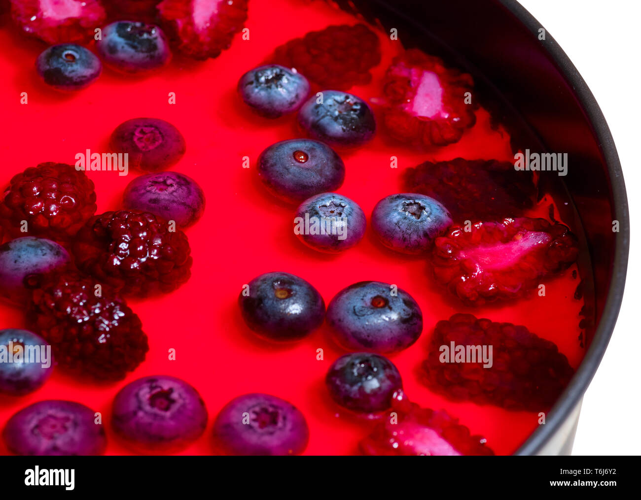Red cheesecake with wild berries Stock Photo - Alamy