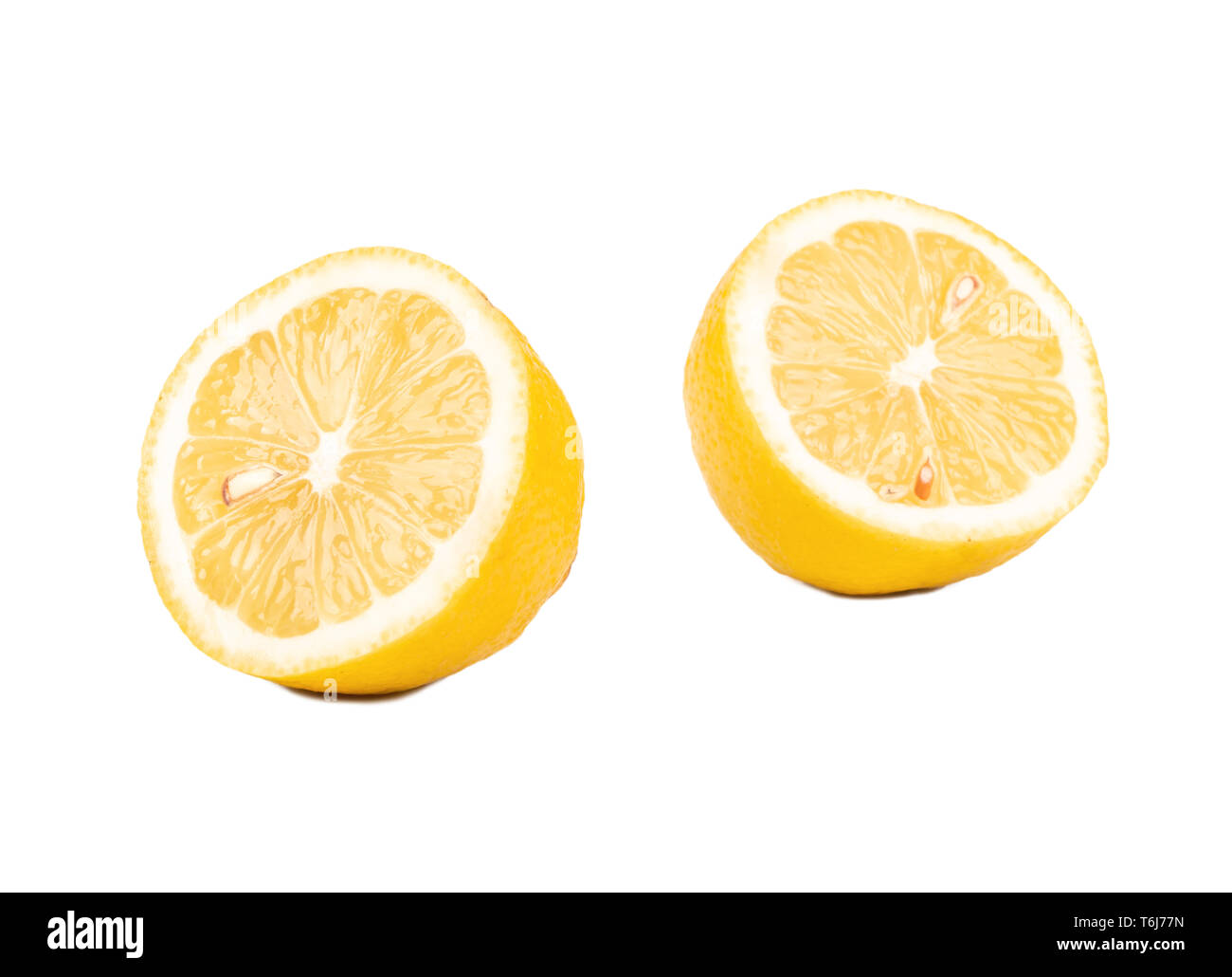 Lemon cut into two halves on a white background Stock Photo - Alamy