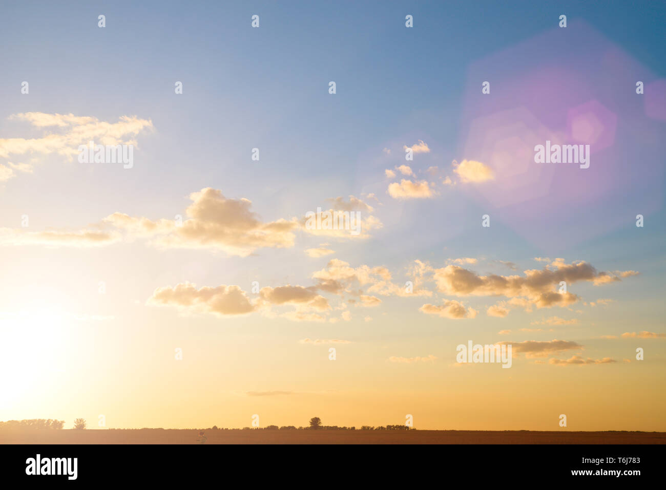 Sunset sky in summer (with flares ver Stock Photo - Alamy
