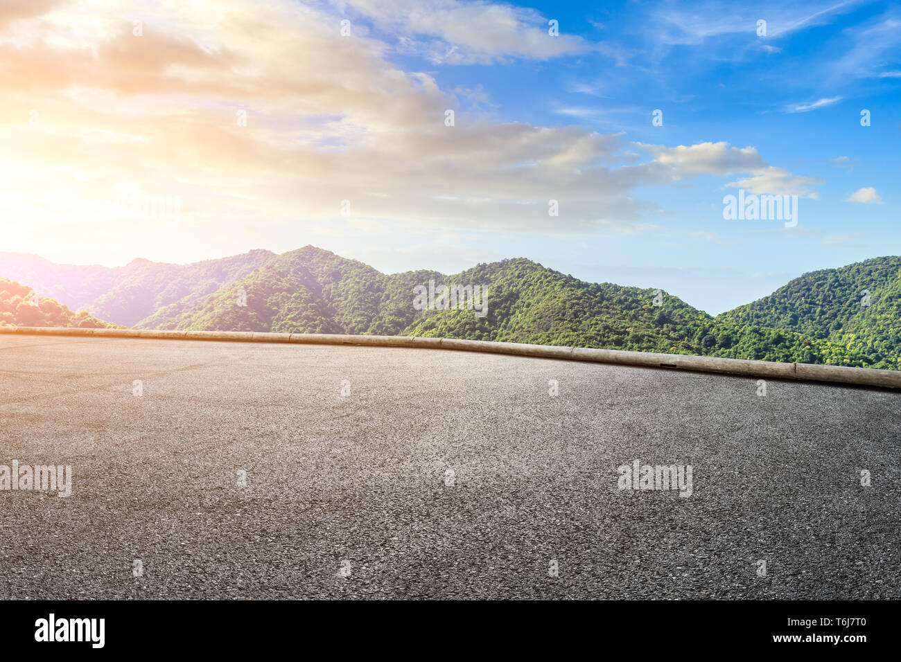 Empty asphalt road and beautiful natural landscape at sunset Stock ...