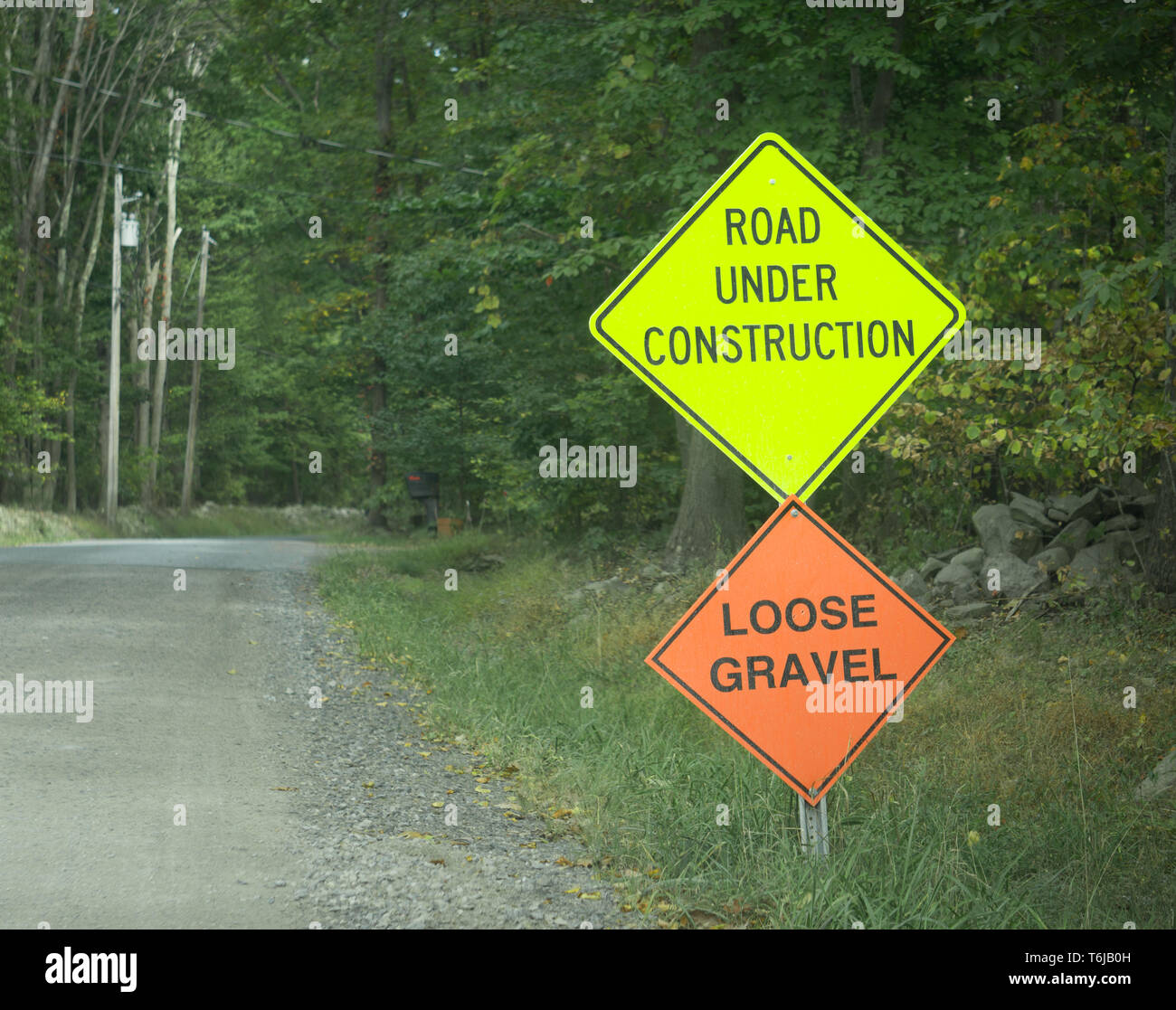 Road construction sign on a dirt road in summertime Stock Photo - Alamy