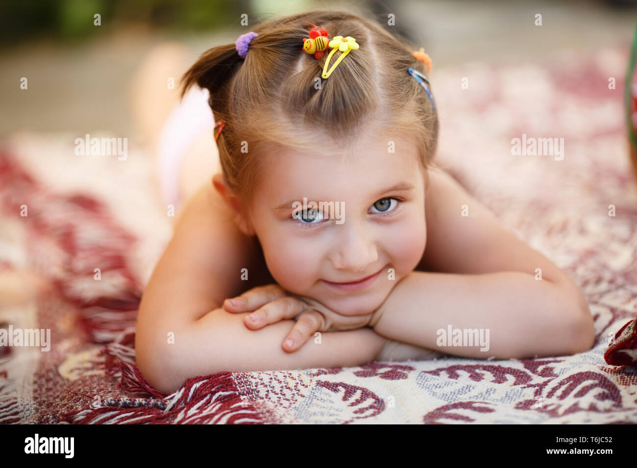 Child resting outdoors Stock Photo - Alamy