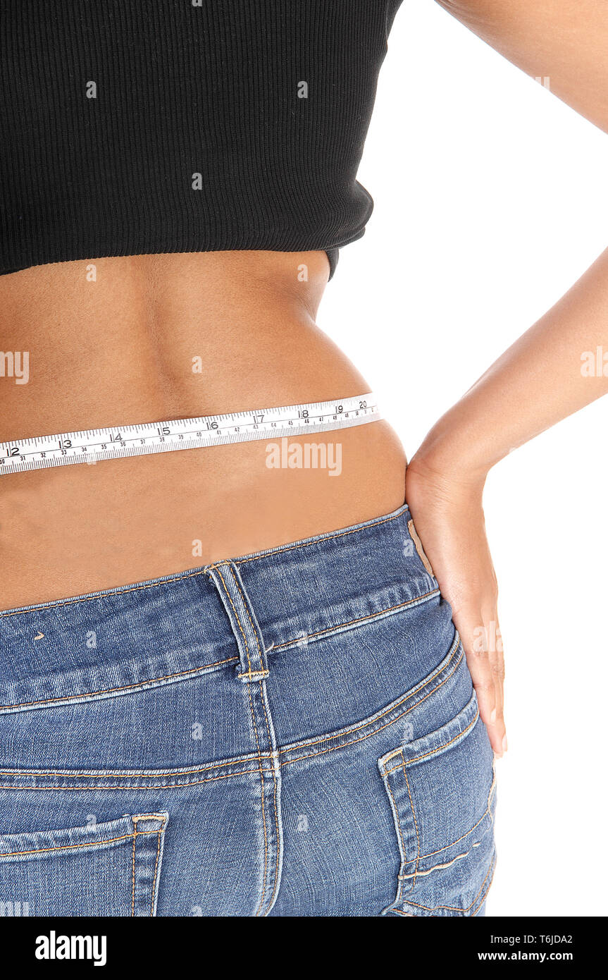 The rear of a woman measuring her hips Stock Photo - Alamy