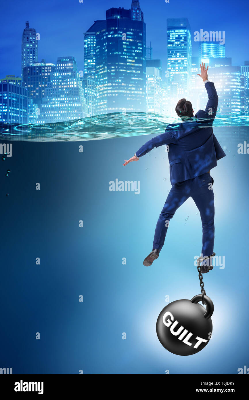 Businessman drowning under the burden of sin and guilt Stock Photo - Alamy