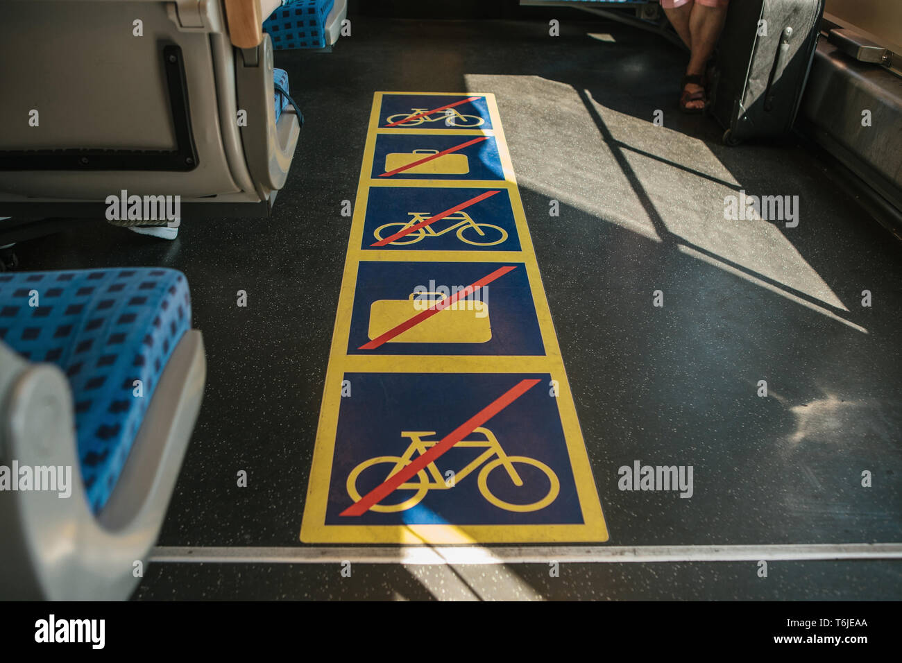 View inside the modern train to the corridor with signs prohibiting ...