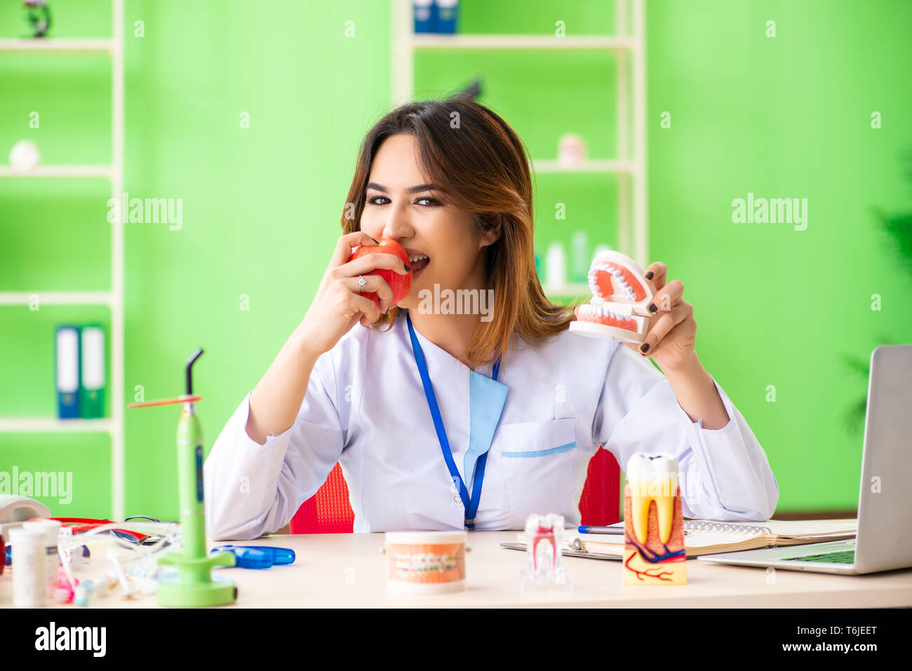 Woman dentist working on teeth implant Stock Photo - Alamy
