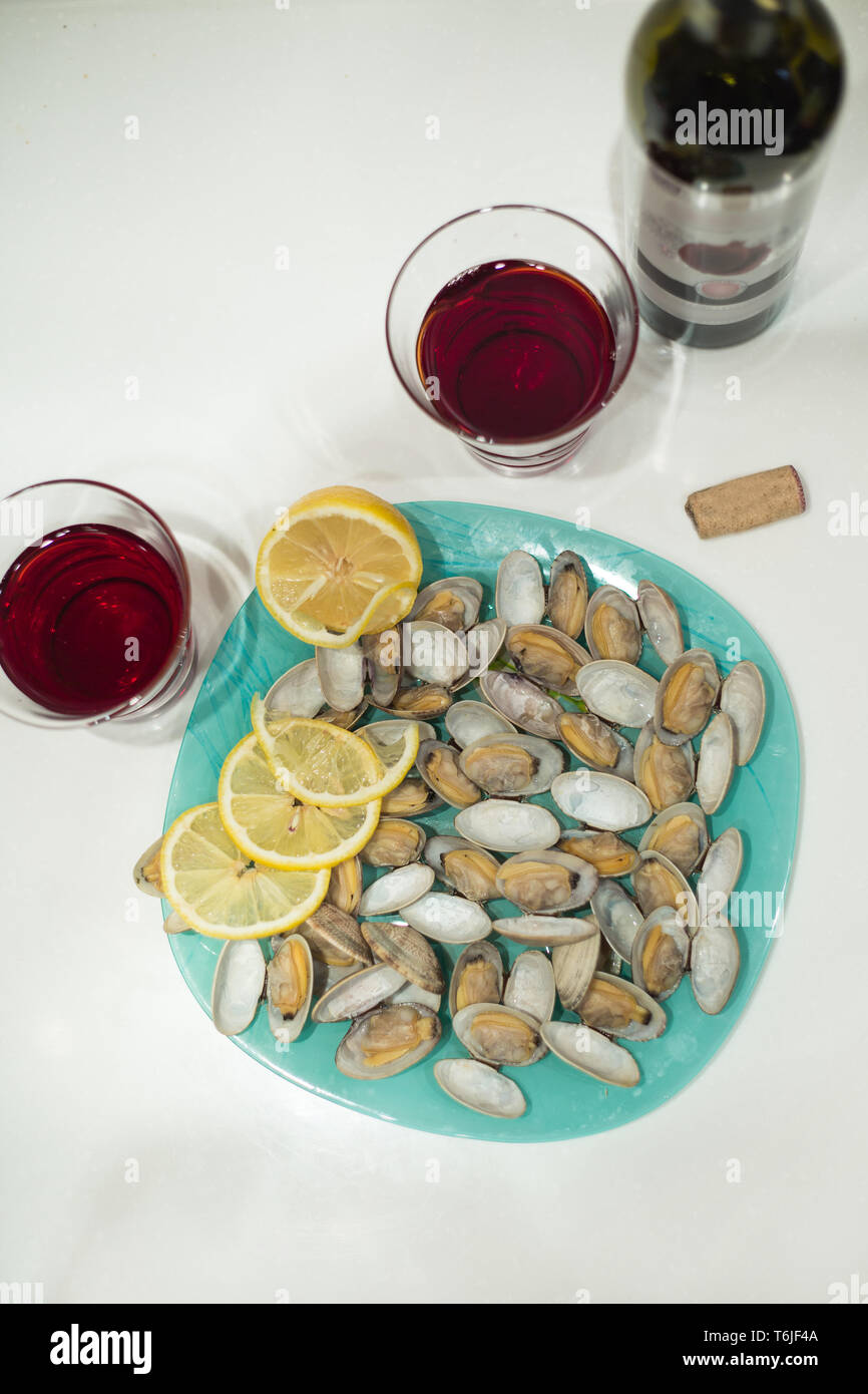 Delicious clam Spisula on foil cooking in the oven grilled next to ...