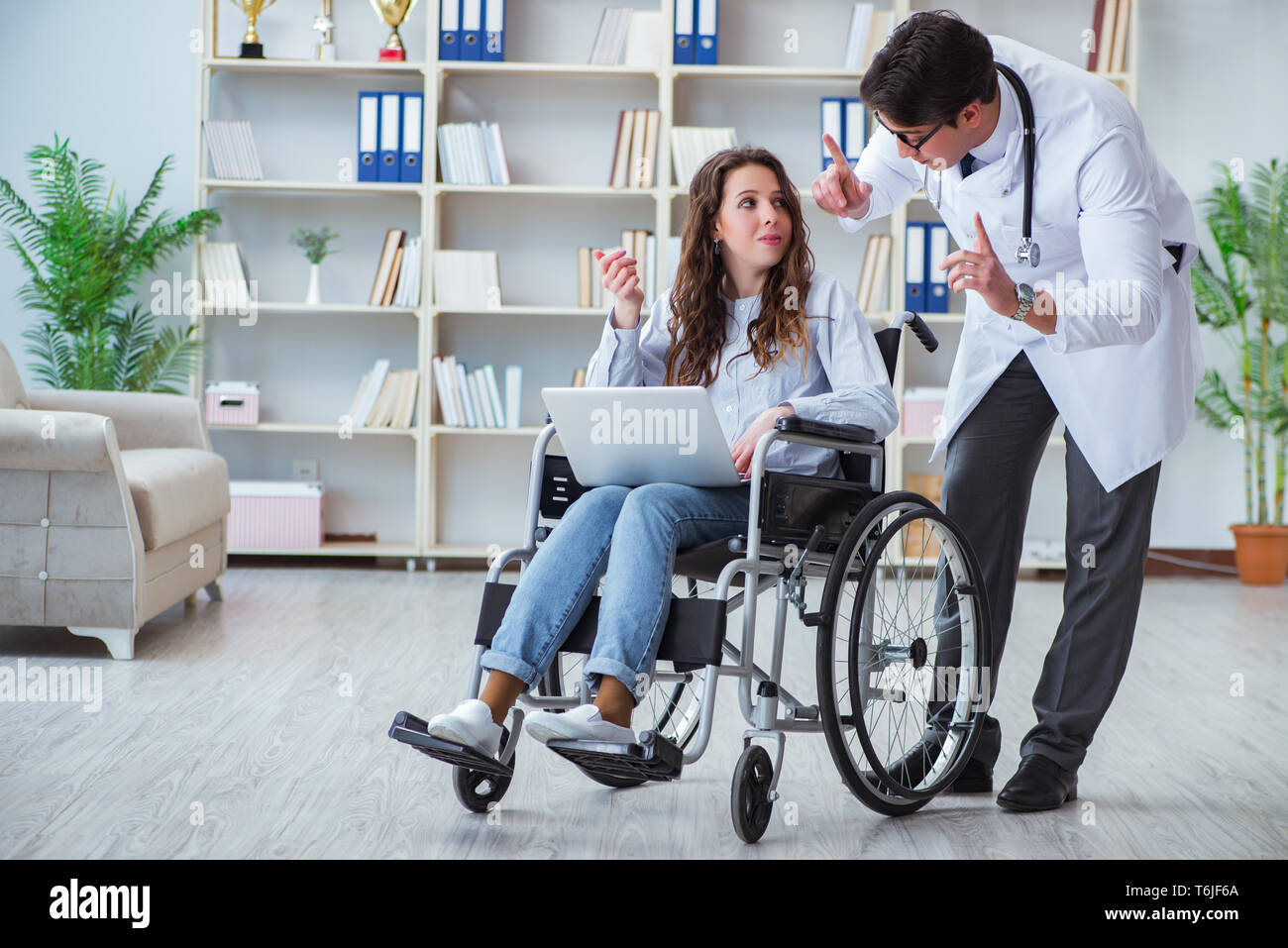 Disabled patient on wheelchair visiting doctor for regular check Stock ...