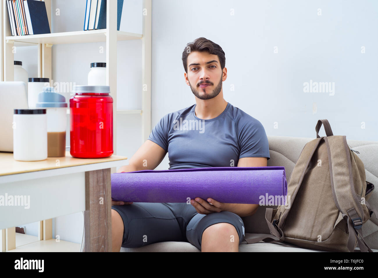 Young man getting ready for gym sports Stock Photo - Alamy