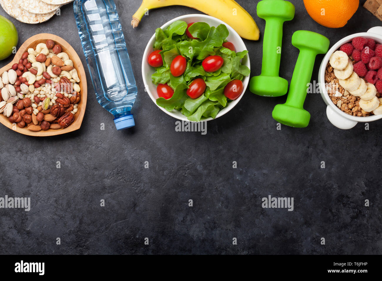 Healthy food concept. Salad, fruits, vegetables, nuts and cereal. Top ...