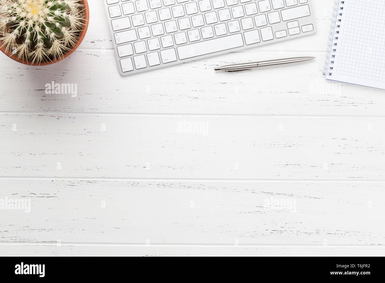 Office workplace table with cactus, supplies and computer. Flat lay ...
