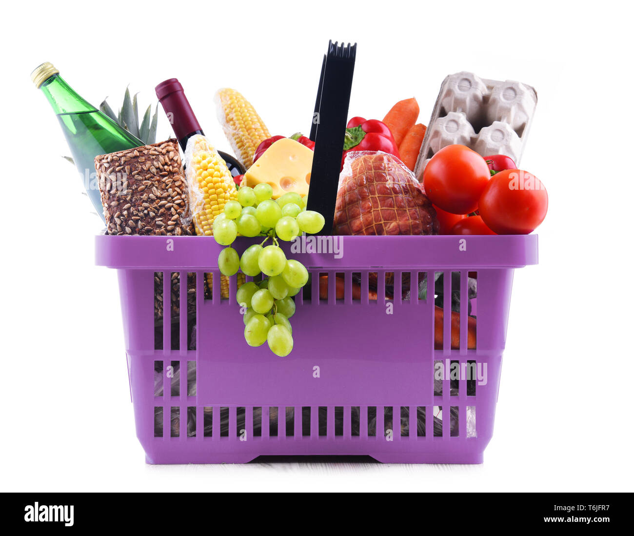 Plastic shopping basket with assorted grocery products isolated on ...