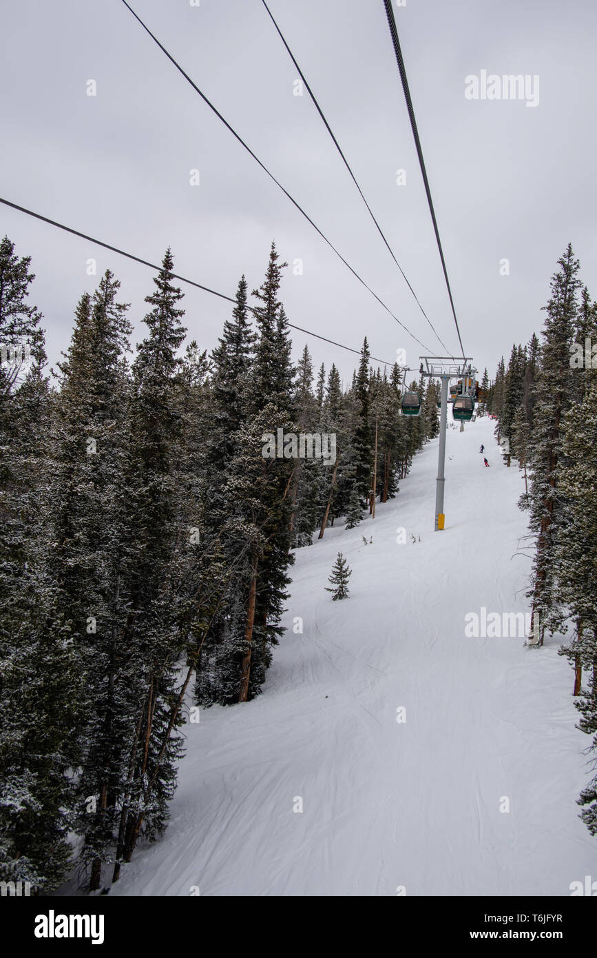 Chair Lift. People skiing and preparing to ski at Keystone Ski Resort ...