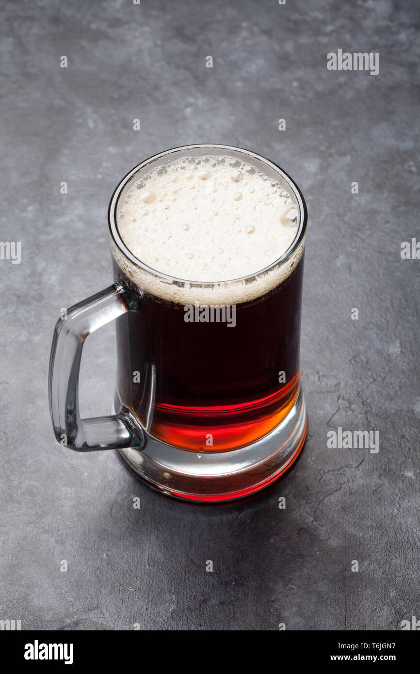 Glass of dark porter beer on stone table Stock Photo - Alamy