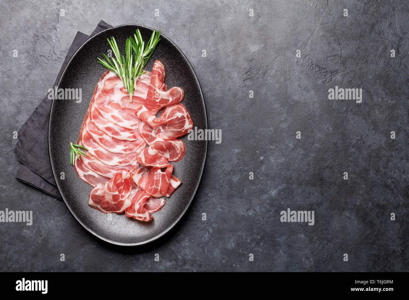 Traditional spanish jamon, prosciutto crudo, italian salami, parma ham ...