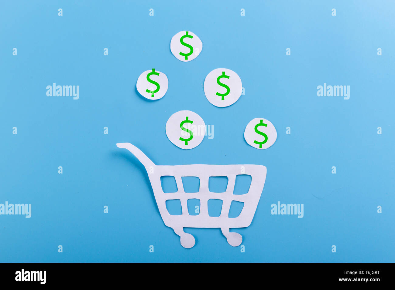 shopping trolley with money in it. spend money concept Stock Photo - Alamy