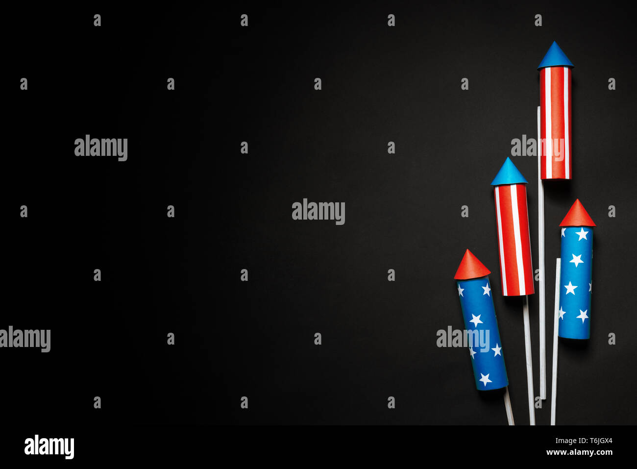 July 4, rockets for fireworks on a blue red background with space for ...