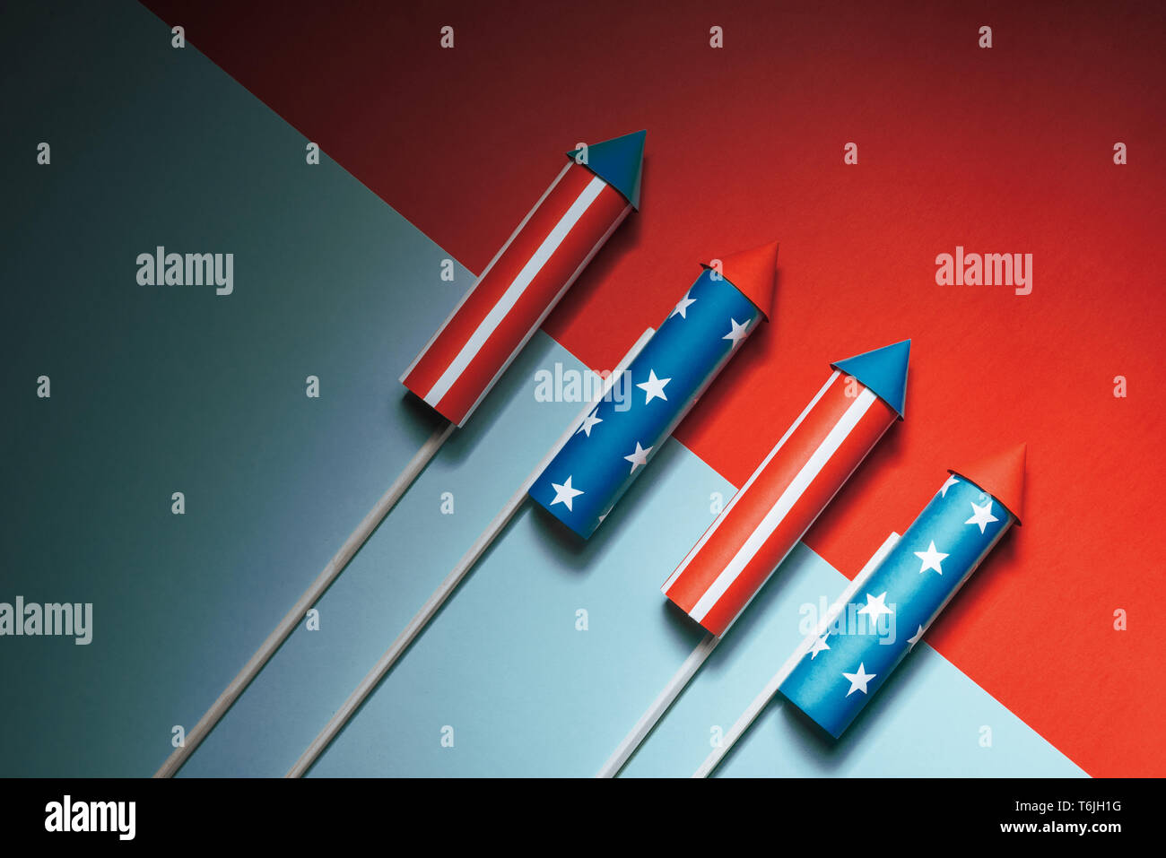 July 4, rockets for fireworks on a blue red background with space for ...