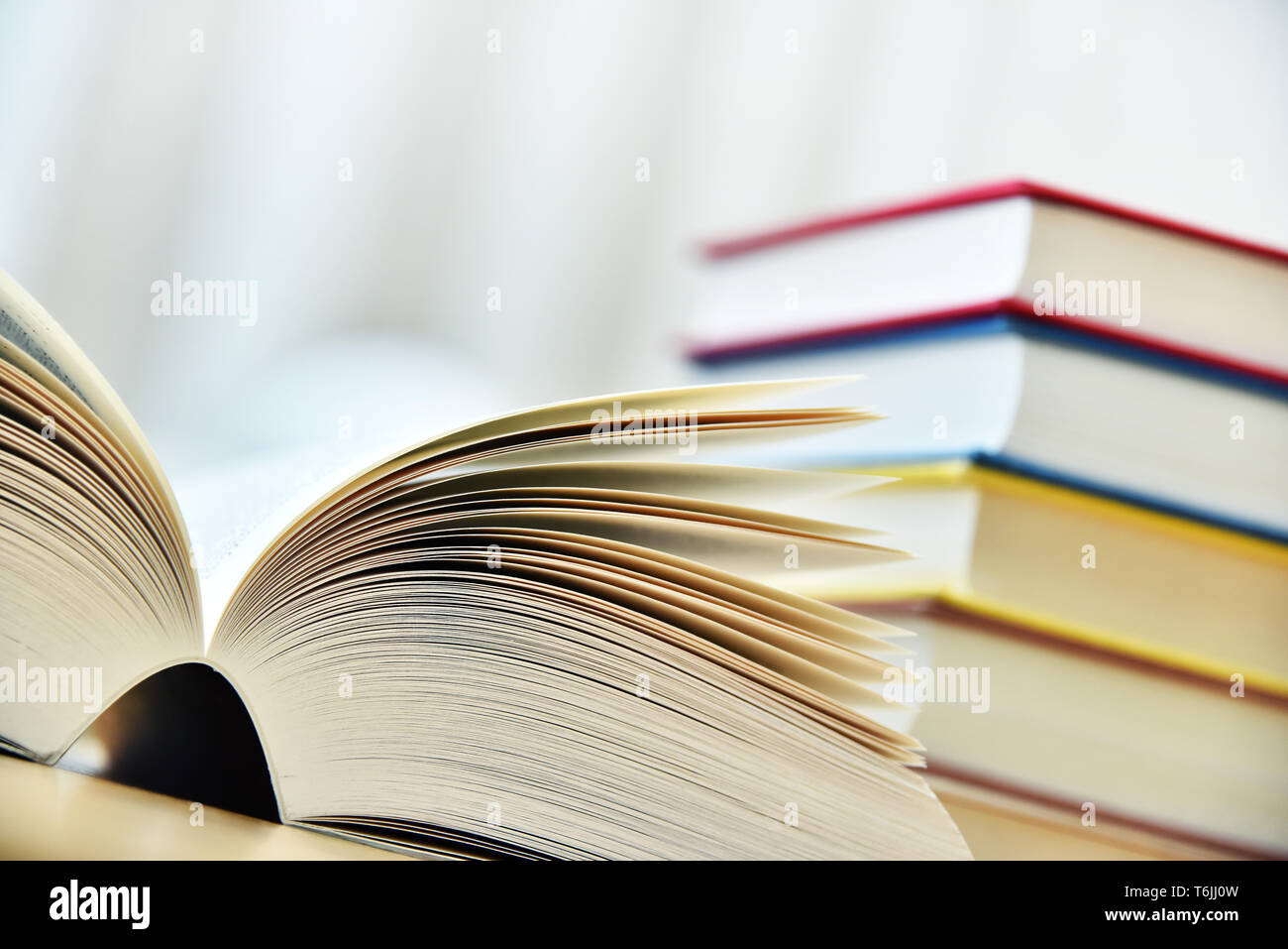 Books lying on the table in the public library Stock Photo - Alamy