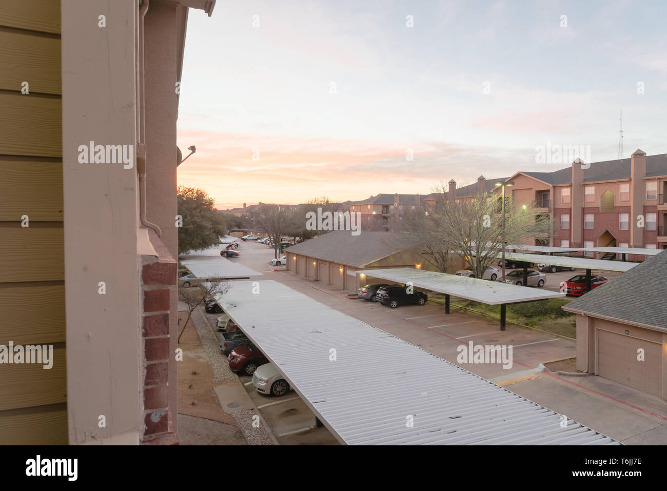 Typical apartment complex with detached garage and covered parking lots ...