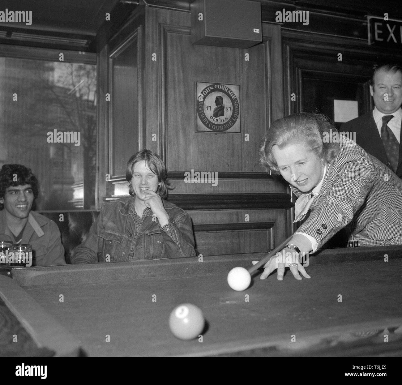 Conservative Party leader Margaret Thatcher tries her hand on the pool ...