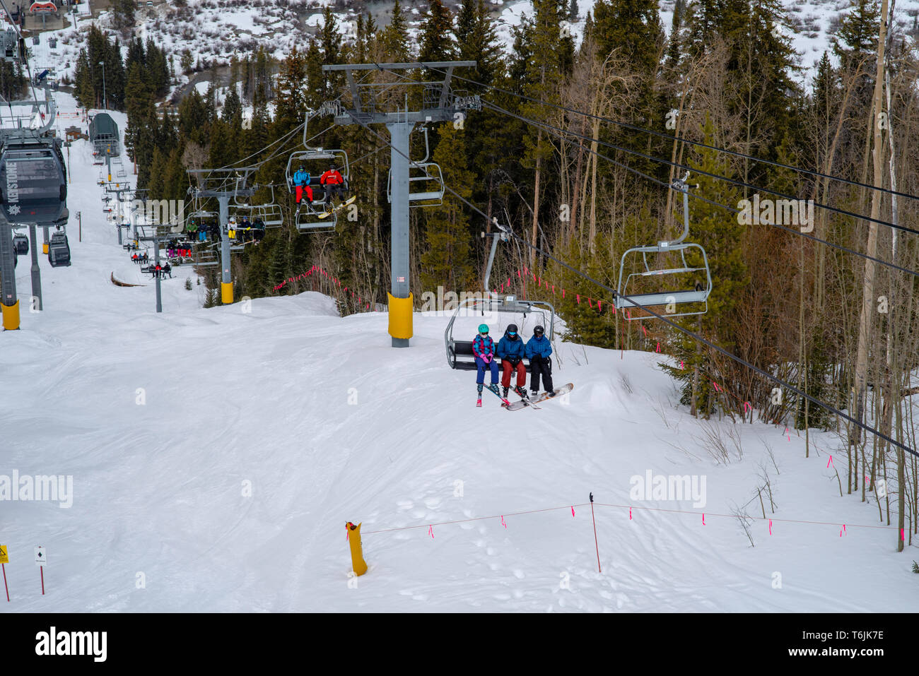 Chair Lift. People skiing and preparing to ski at Keystone Ski Resort ...