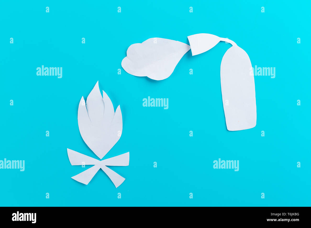 extinguisher fighting fire close up. blue background Stock Photo - Alamy