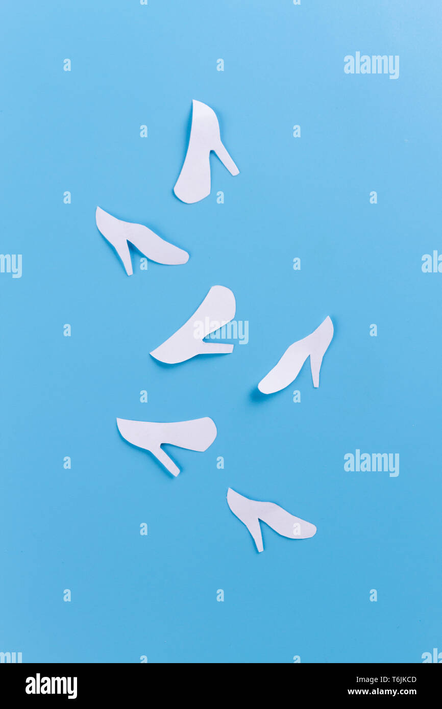 paper art of shoes on the blue background Stock Photo - Alamy