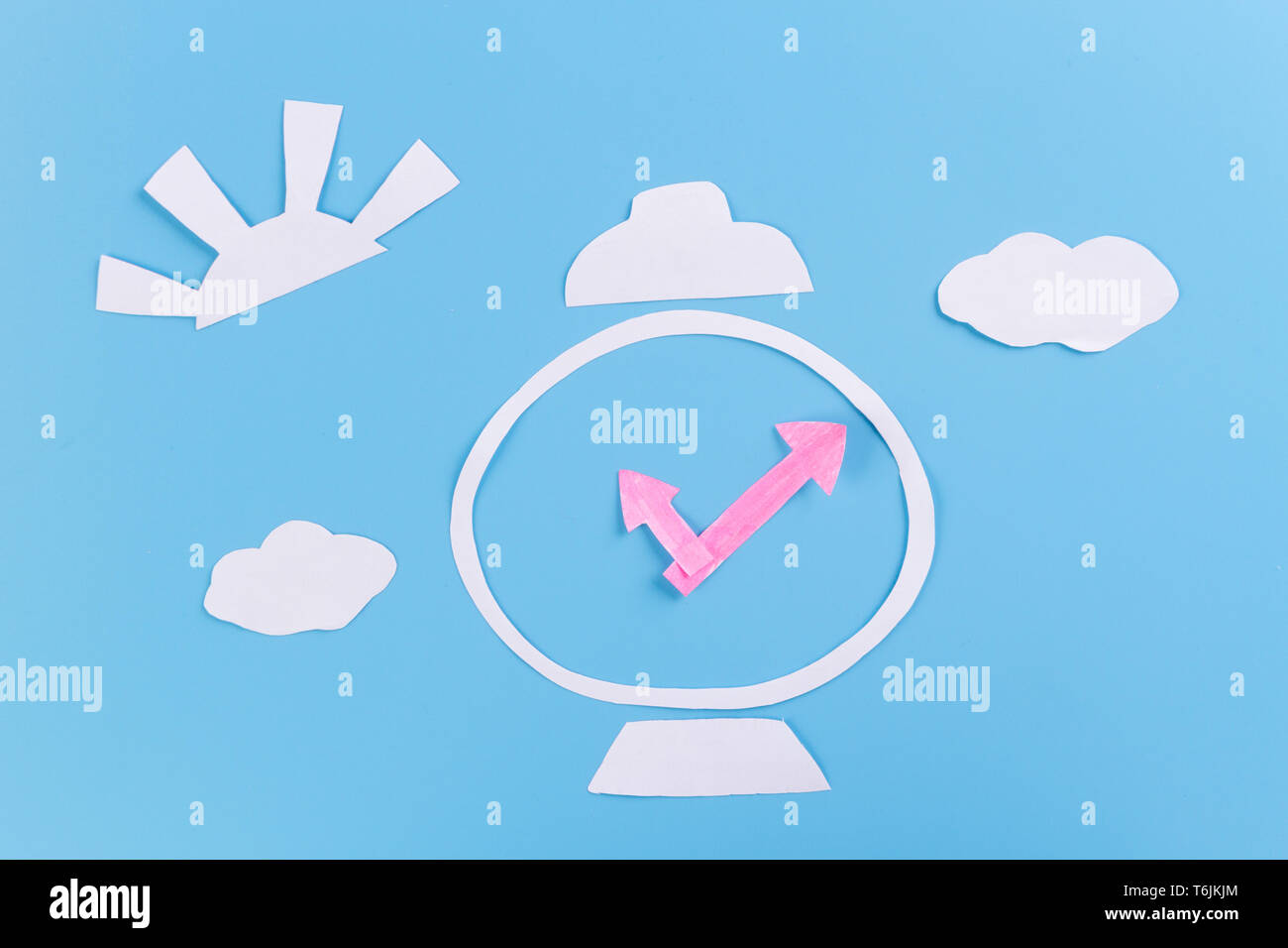 clock on blue background. early morning concept image Stock Photo - Alamy