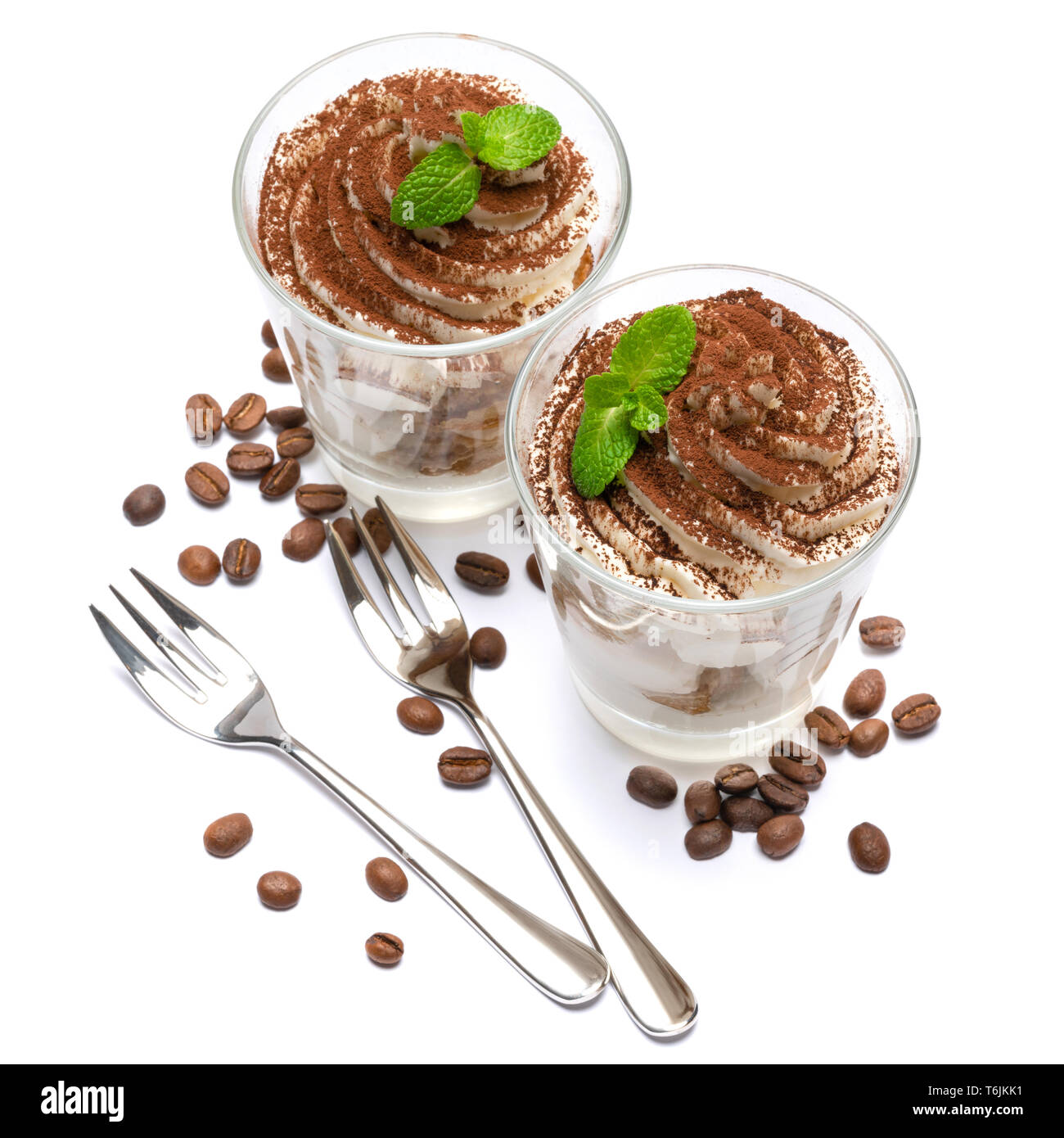 two portions Classic tiramisu dessert in a glass isolated on a white ...