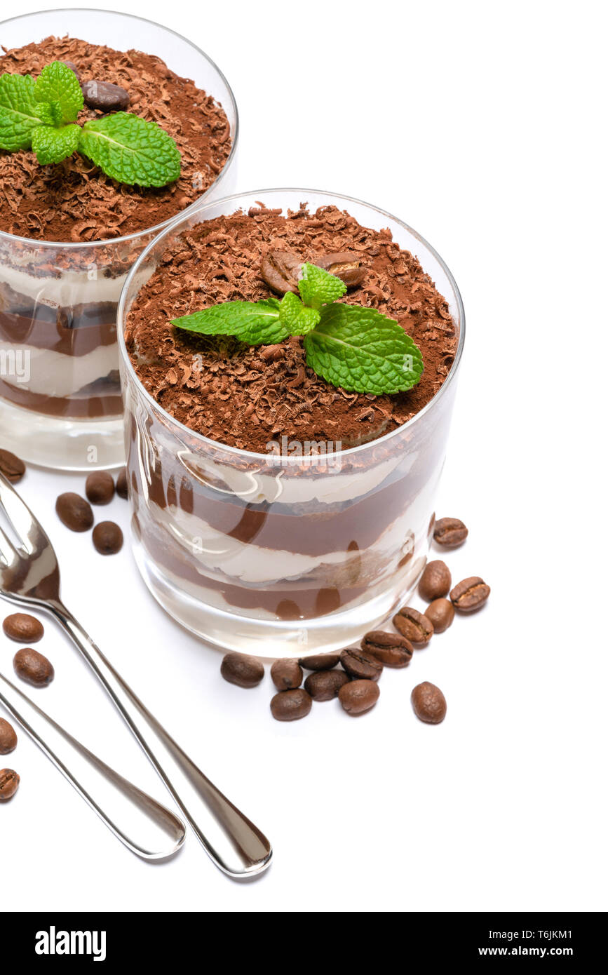 two portions Classic tiramisu dessert in a glass isolated on a white ...