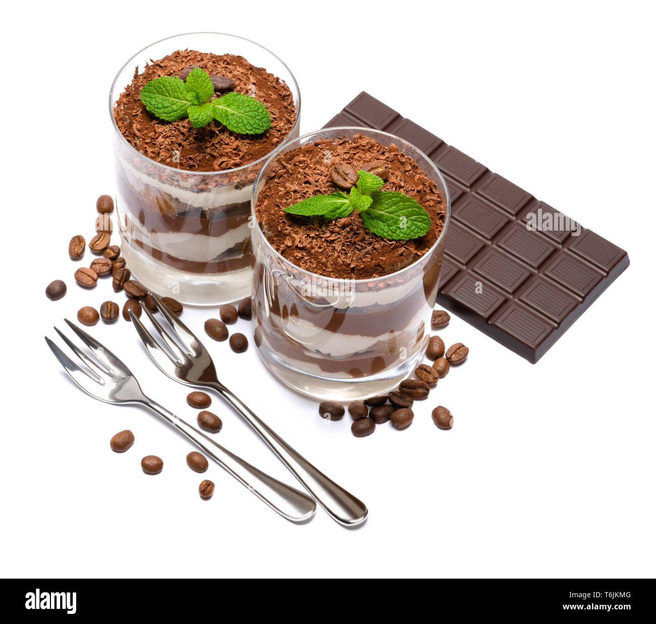 two portions Classic tiramisu dessert in a glass and chocolate bar ...