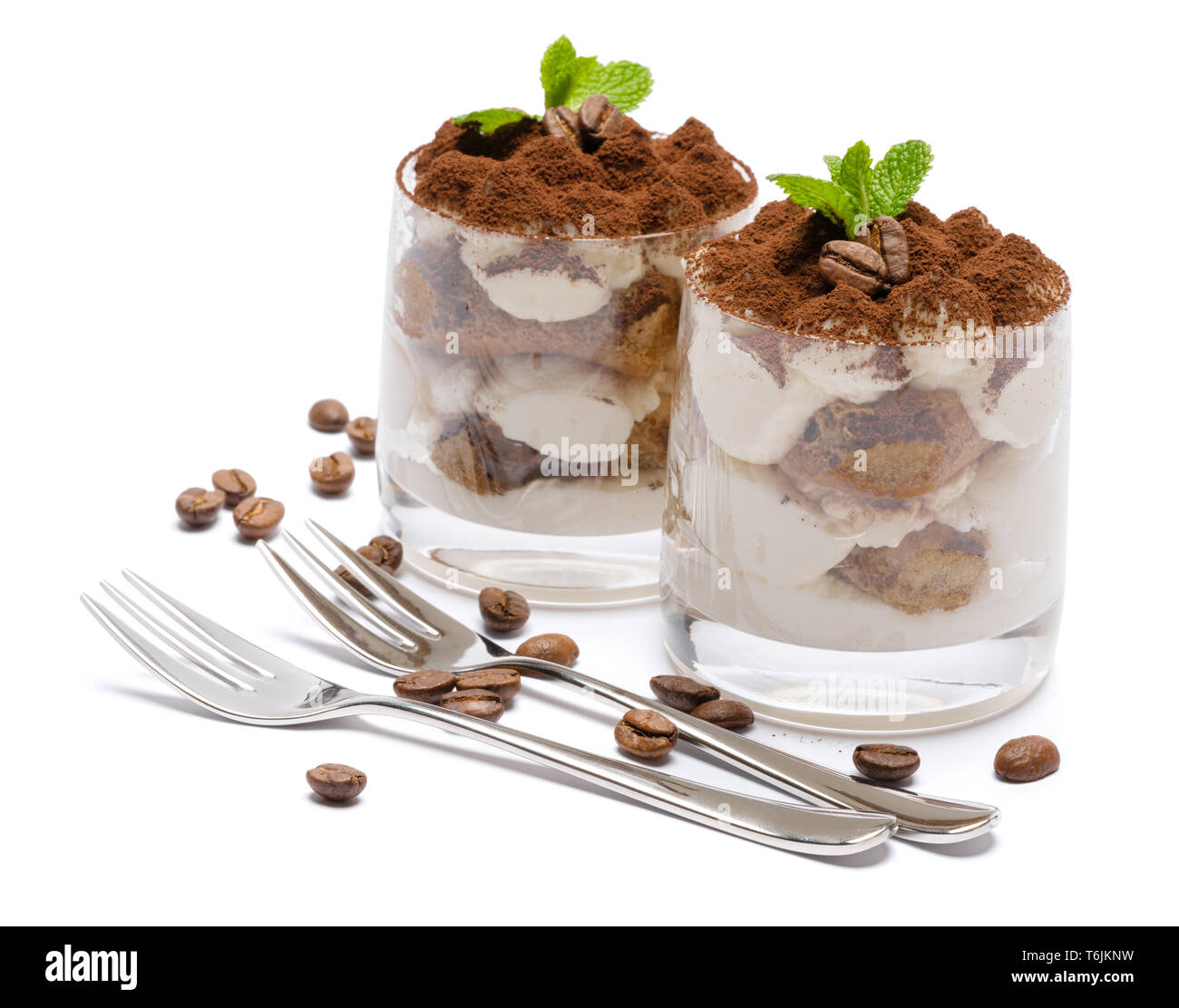two portions Classic tiramisu dessert in a glass isolated on a white ...